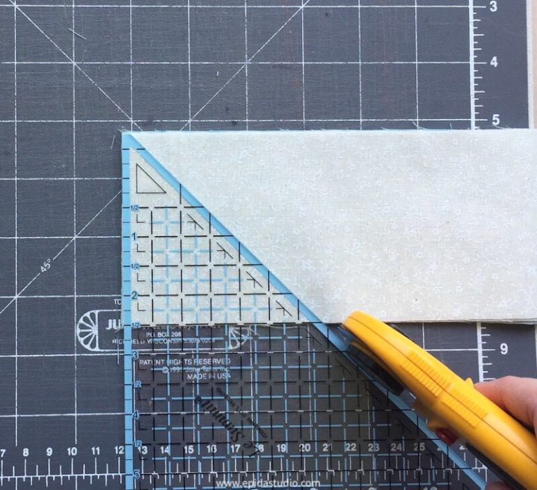 making half-square triangle units by sewing triangles together